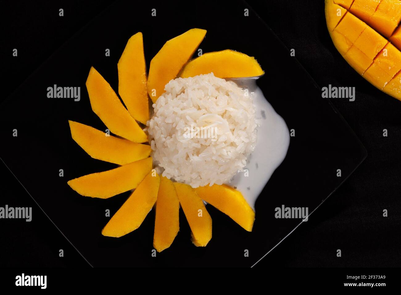 Khao niew mamuang, Mango sticky rice, delicious Thai dessert on black ...