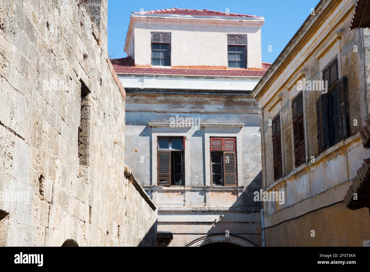 Beautiful ancient facades with blue and yellow colors. Rhodes old town ...