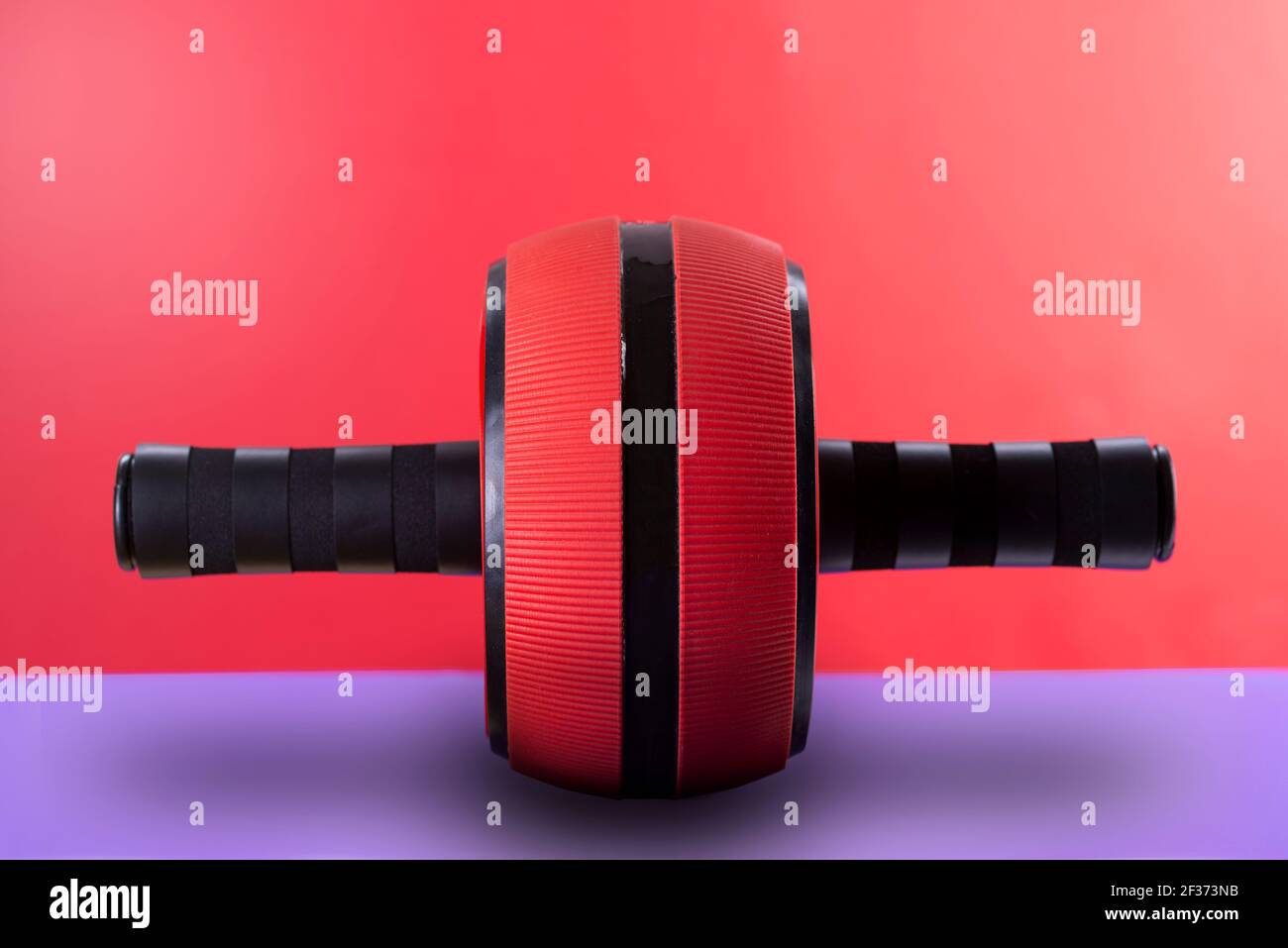 Abdominal roller, abdominal exercises, strength trainer on a mat on a ...