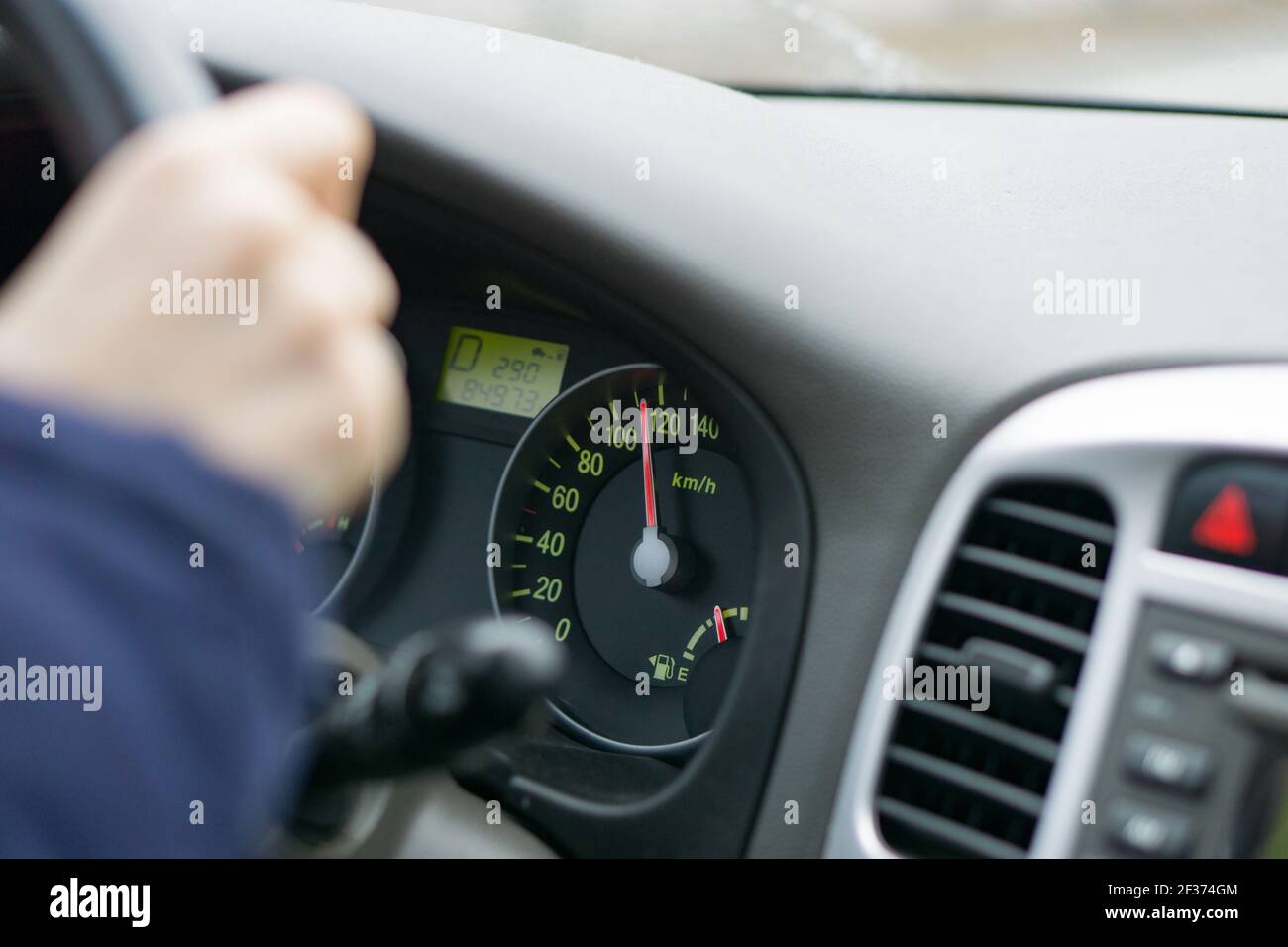 selective focus image of car interior. focus on analog speedometer ...