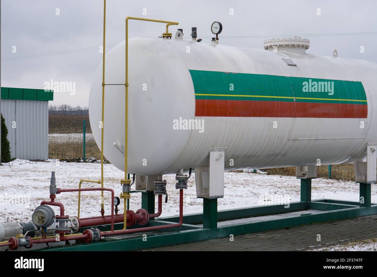 industrial propane gas tank cistern reservoir at car gas station. High ...