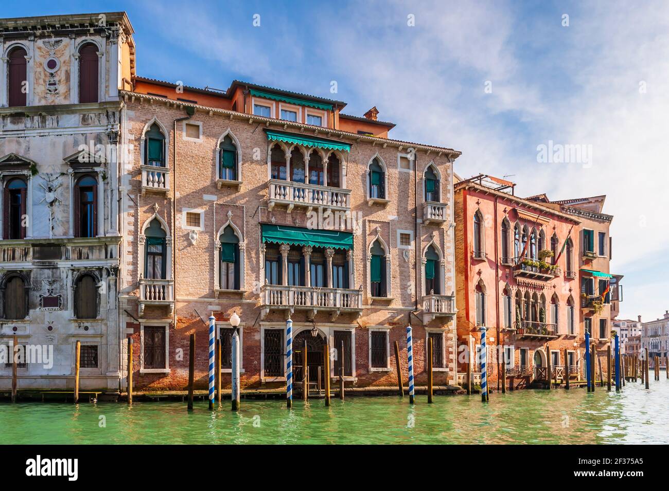 Medieval facades and gondolas on the Grand Canal in Venice in Veneto ...