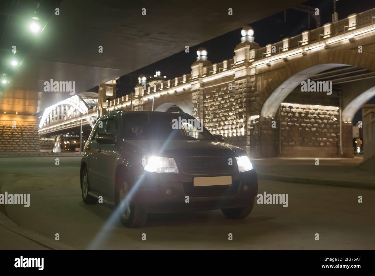 car at night under bridges in the city Stock Photo - Alamy