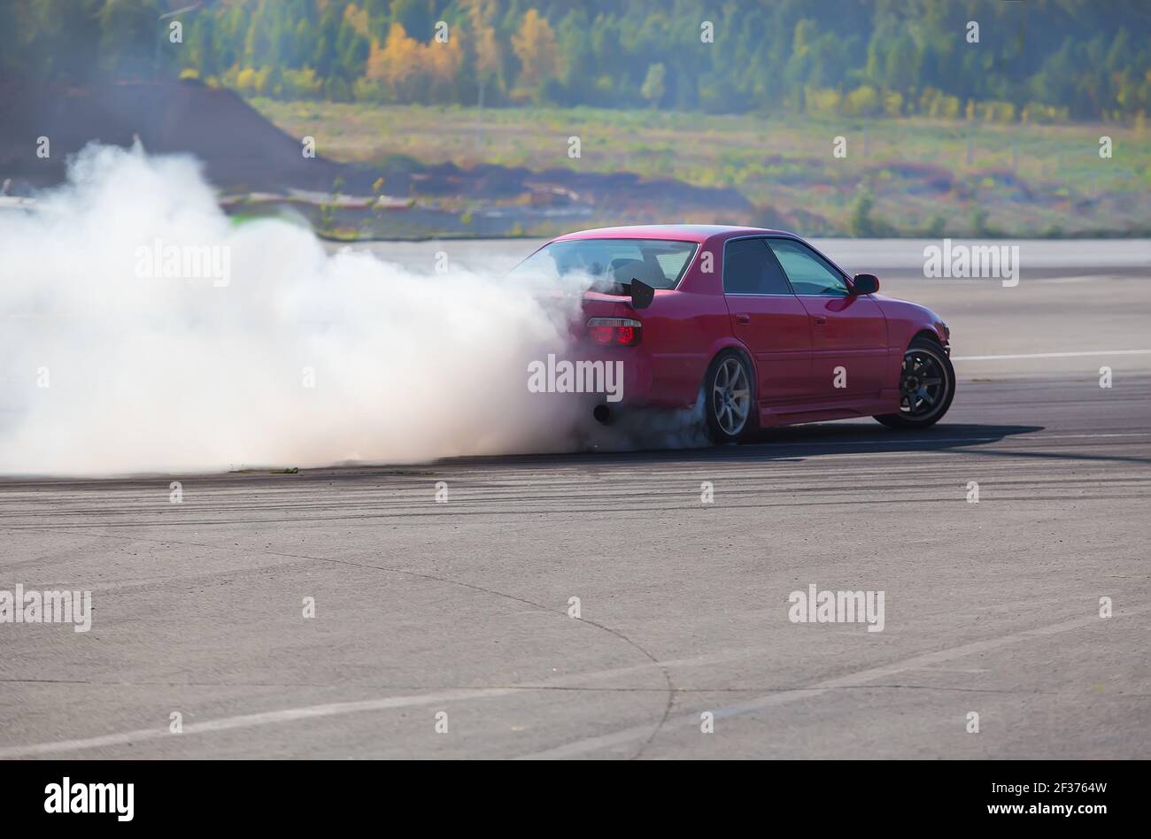 Race car drifting on speed track Stock Photo - Alamy