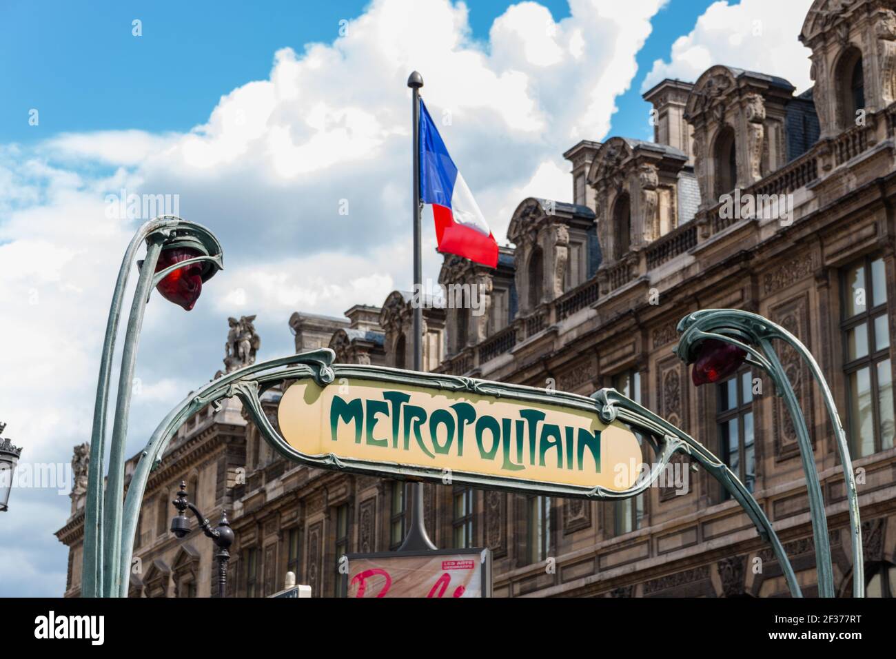 Paris subway sign with French flag and beautiful building as background ...