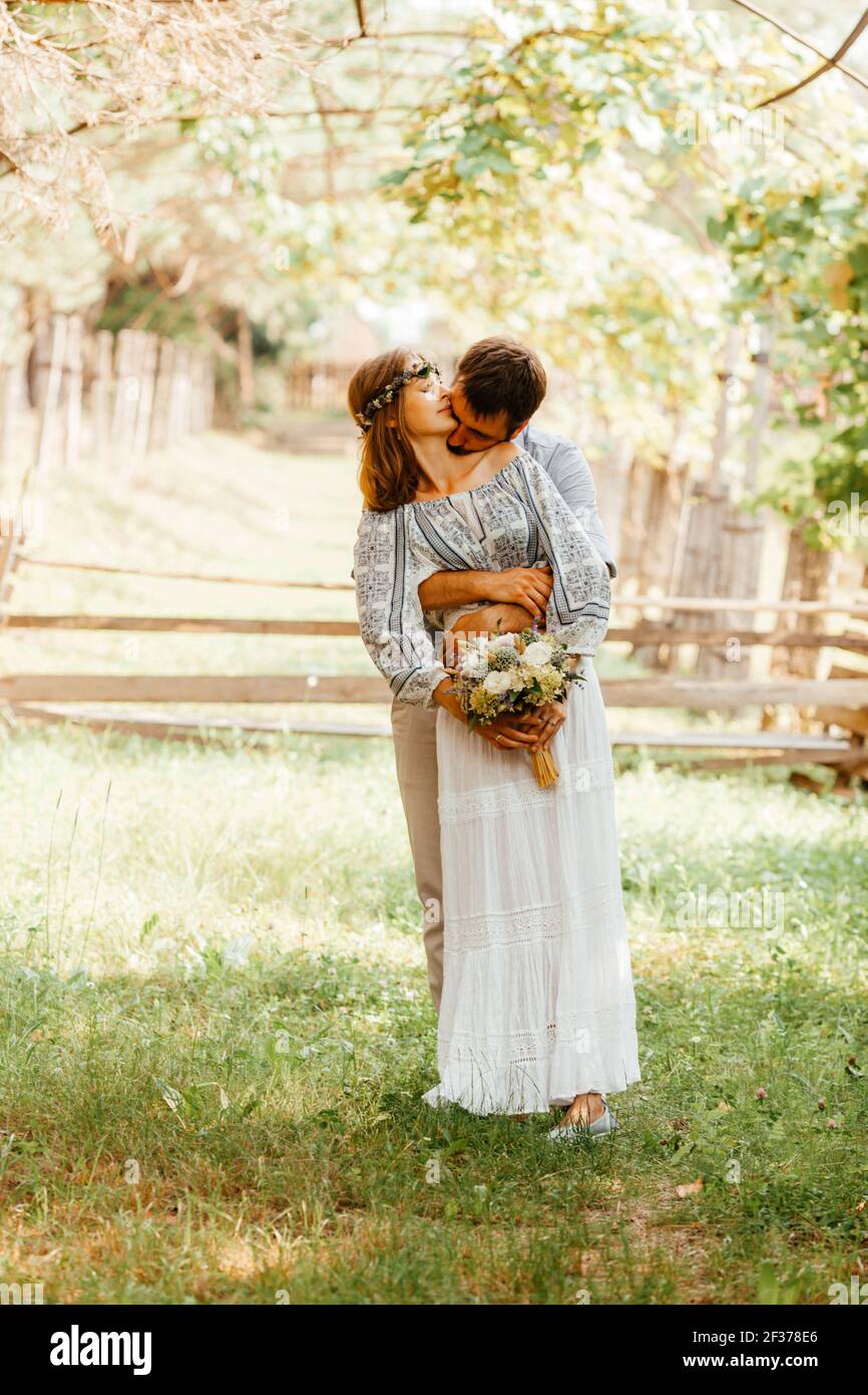 Eclectic rustic wedding couple. Intimate ceremony at backyard Stock ...