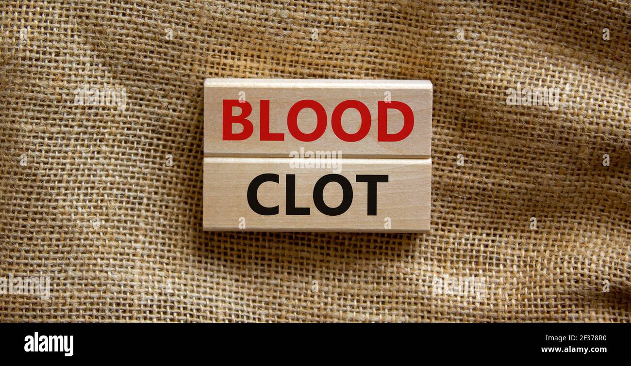 Medical and and blood clot symbol. Wooden blocks with words 'blood clot ...