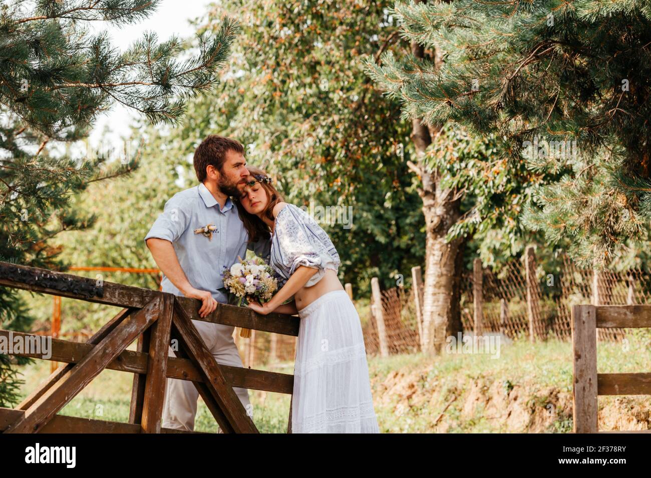 Eclectic rustic wedding couple. Intimate ceremony at backyard Stock ...
