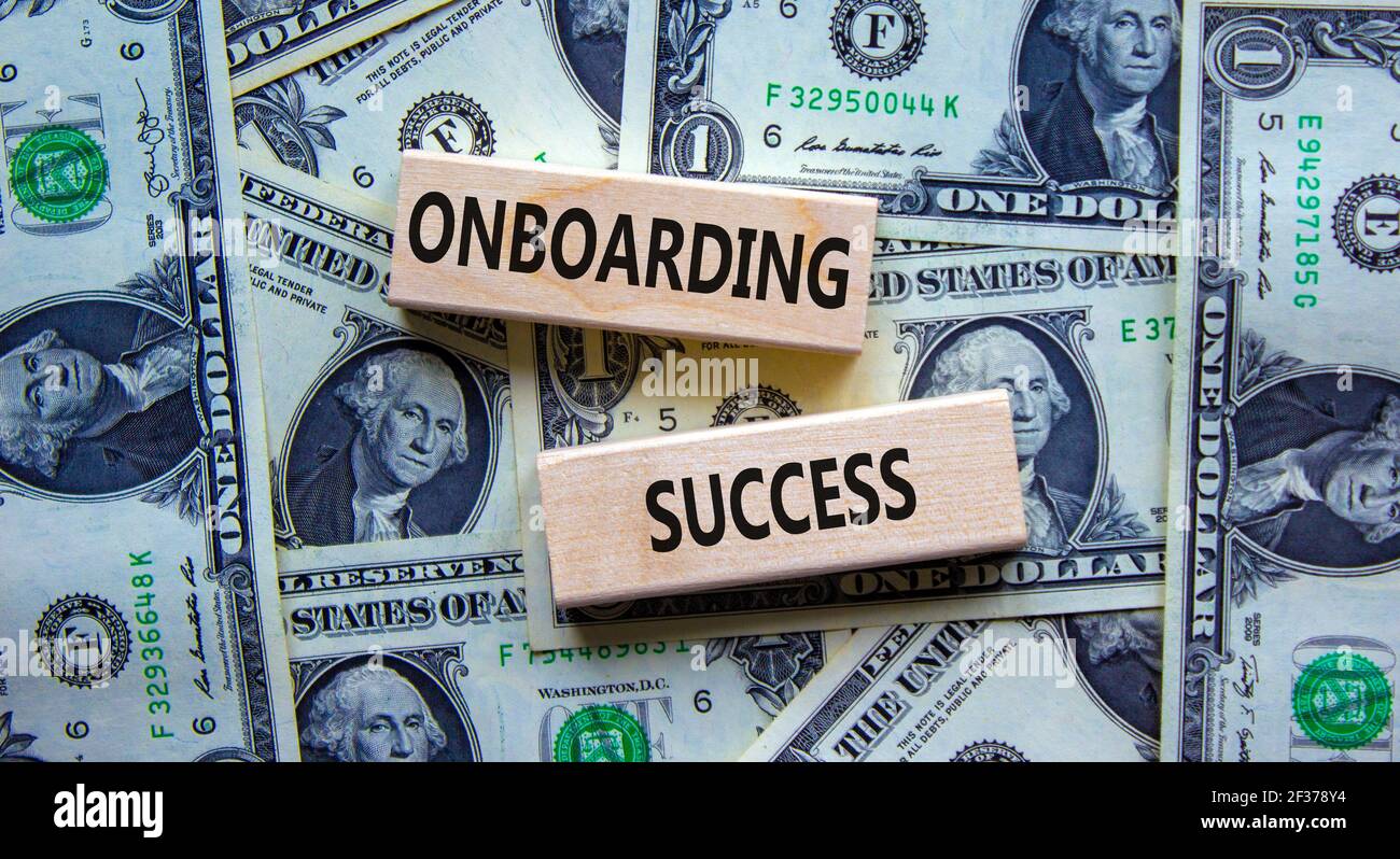 Onboarding success symbol. Wooden blocks with words 'Onboarding success ...
