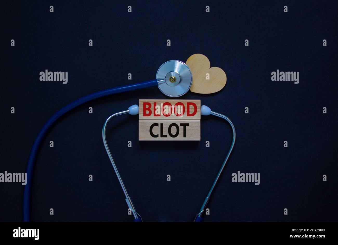 Medical and and blood clot symbol. Wooden blocks with words 'blood clot ...