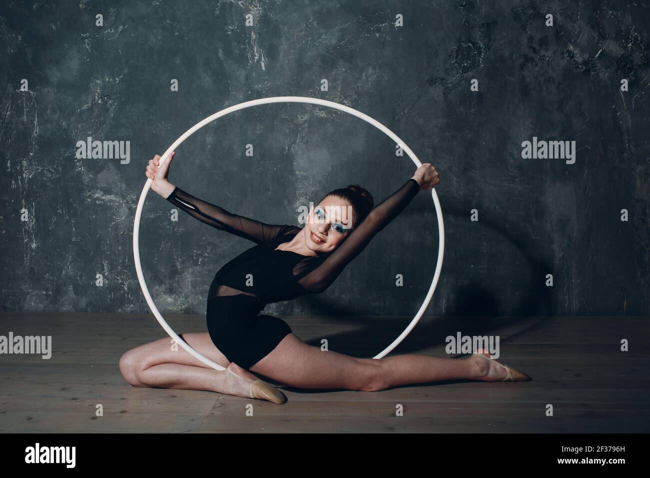 Young girl professional gymnast woman dance rhythmic gymnastics with ...