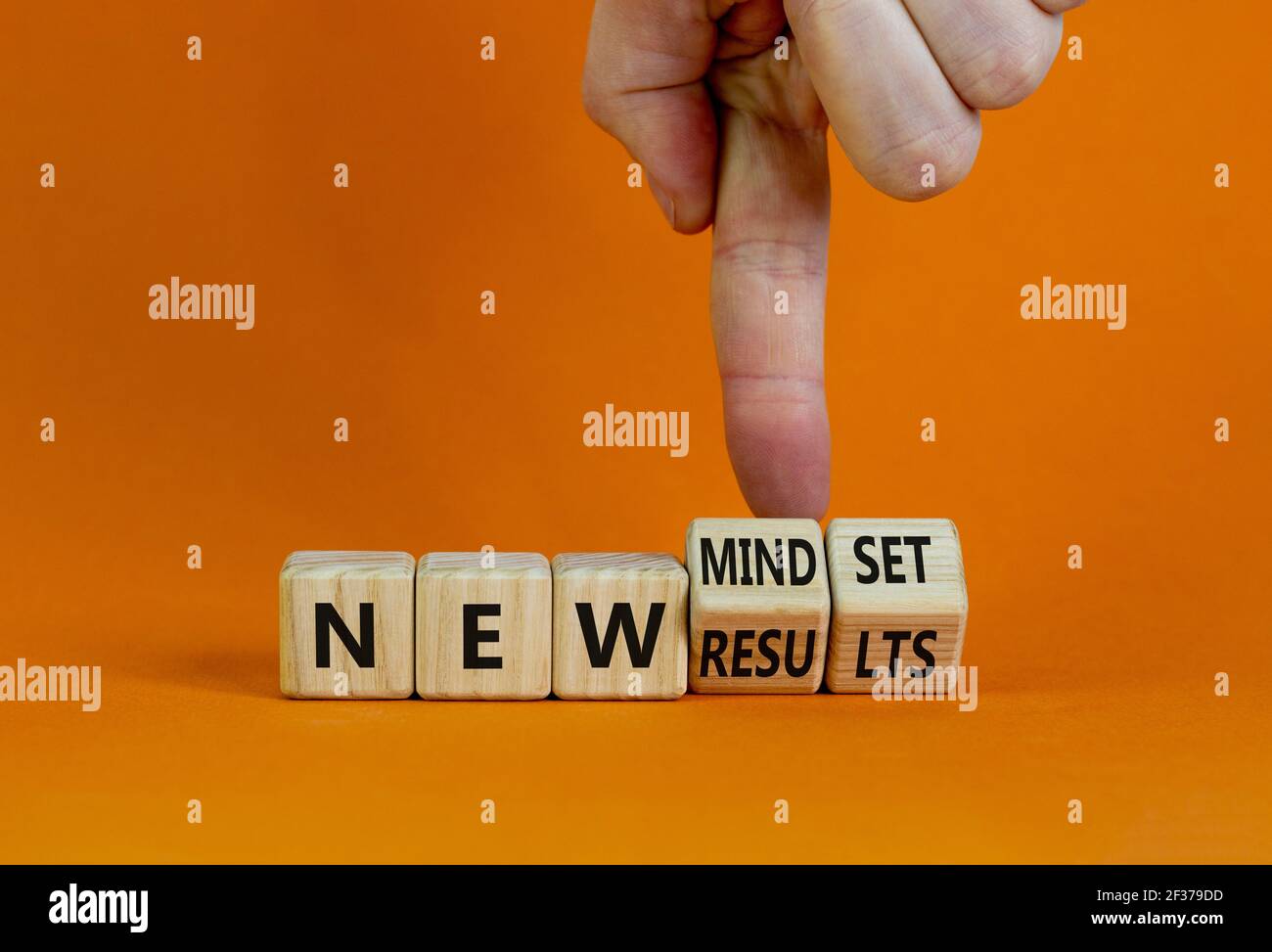 New mindset and results symbol. Businessman turns wooden cubes and ...