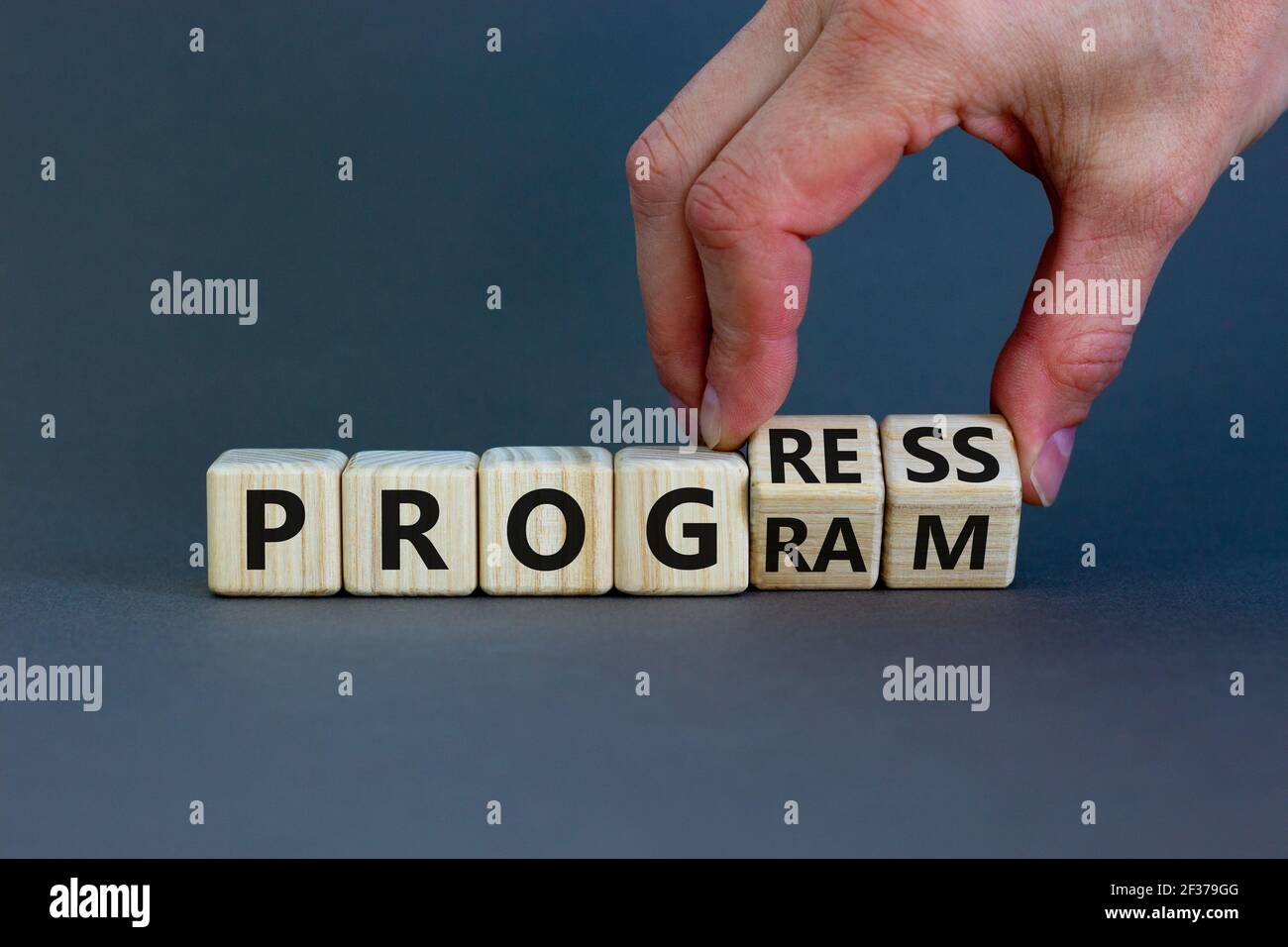 Progress and program symbol. Businessman turns wooden cubes and changes ...