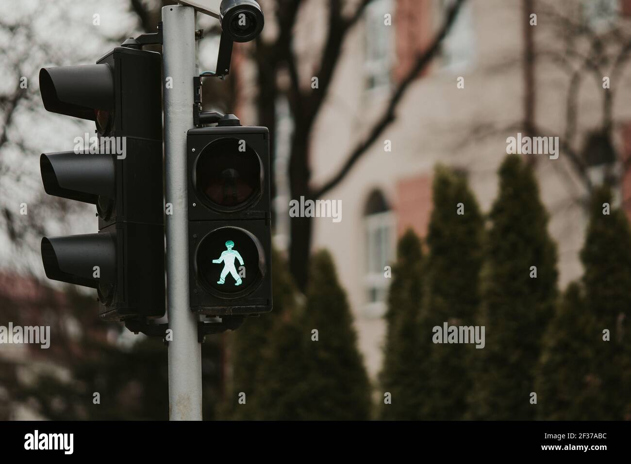 A green pedestrian light on a traffic sign Stock Photo - Alamy