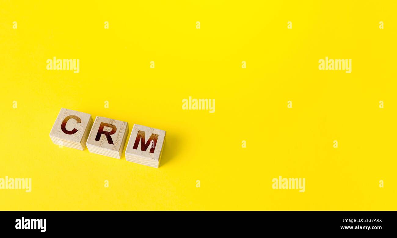 Wooden blocks with CRM (Customer Relationship Management). Data ...