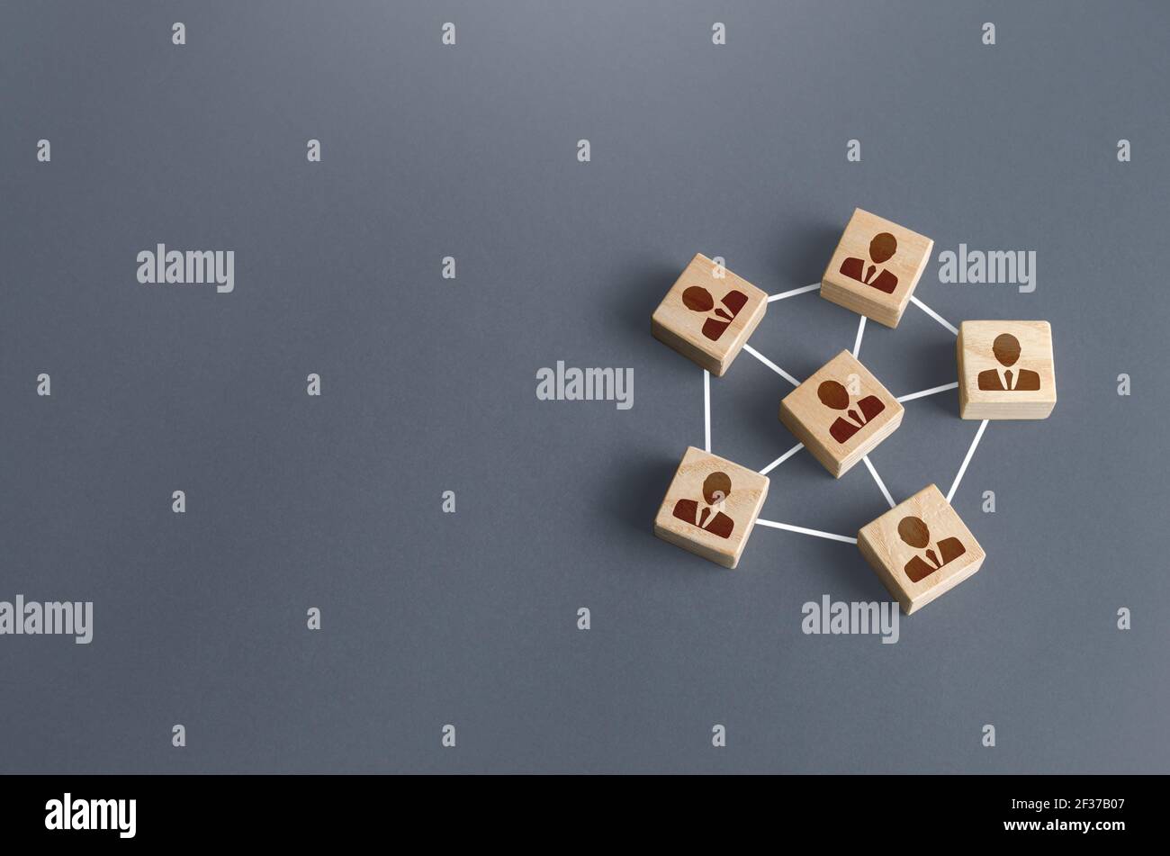 Blocks with businessmen connected by lines into a network team ...