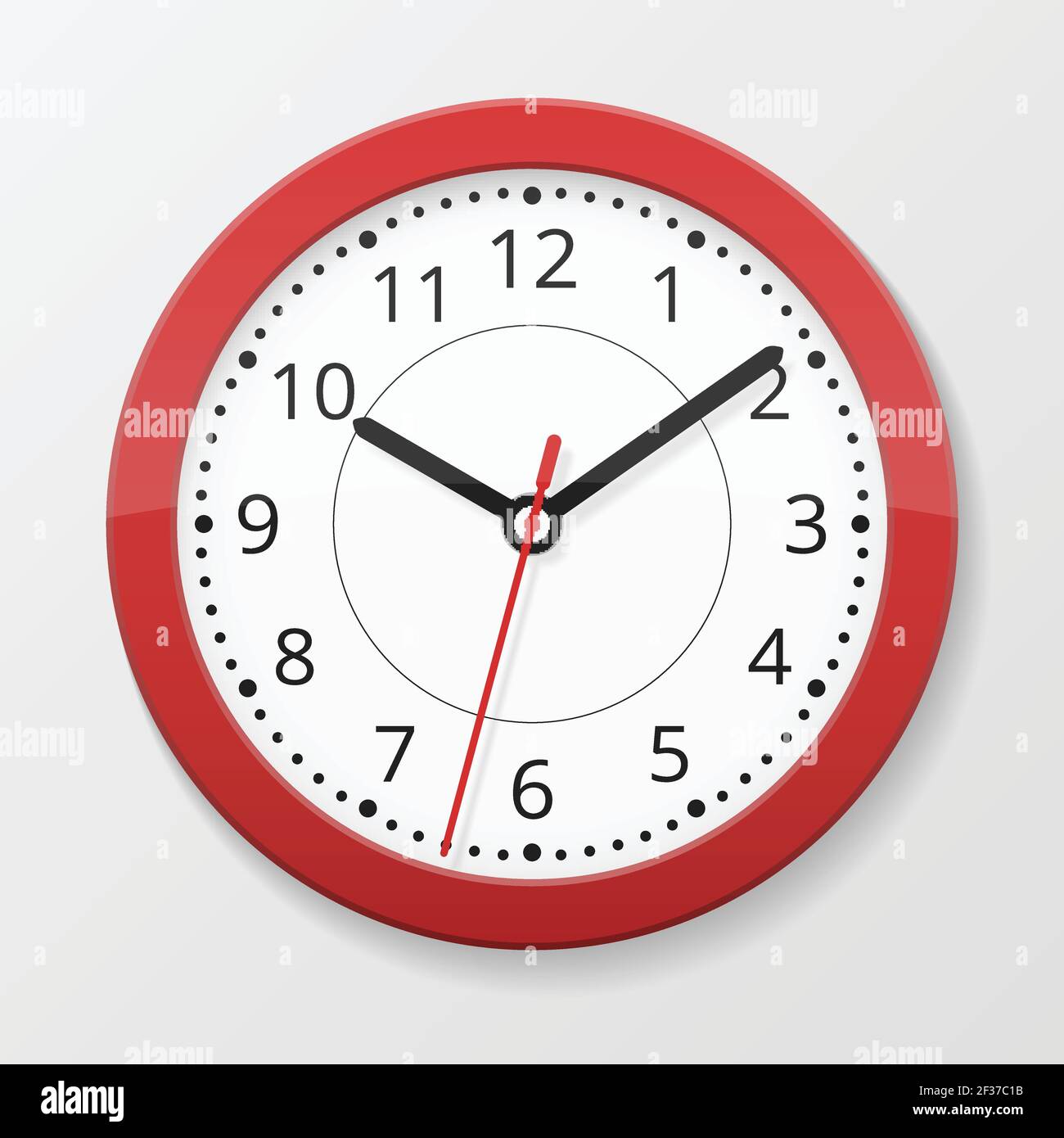Round wall quartz clock in red color isolated on white background with ...