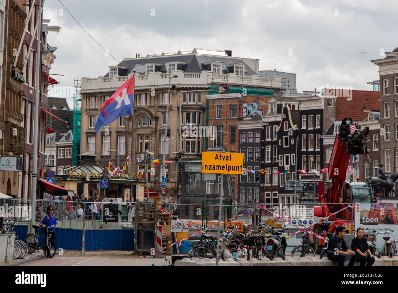 Pedestrians in street with beautiful classic European buildings as ...