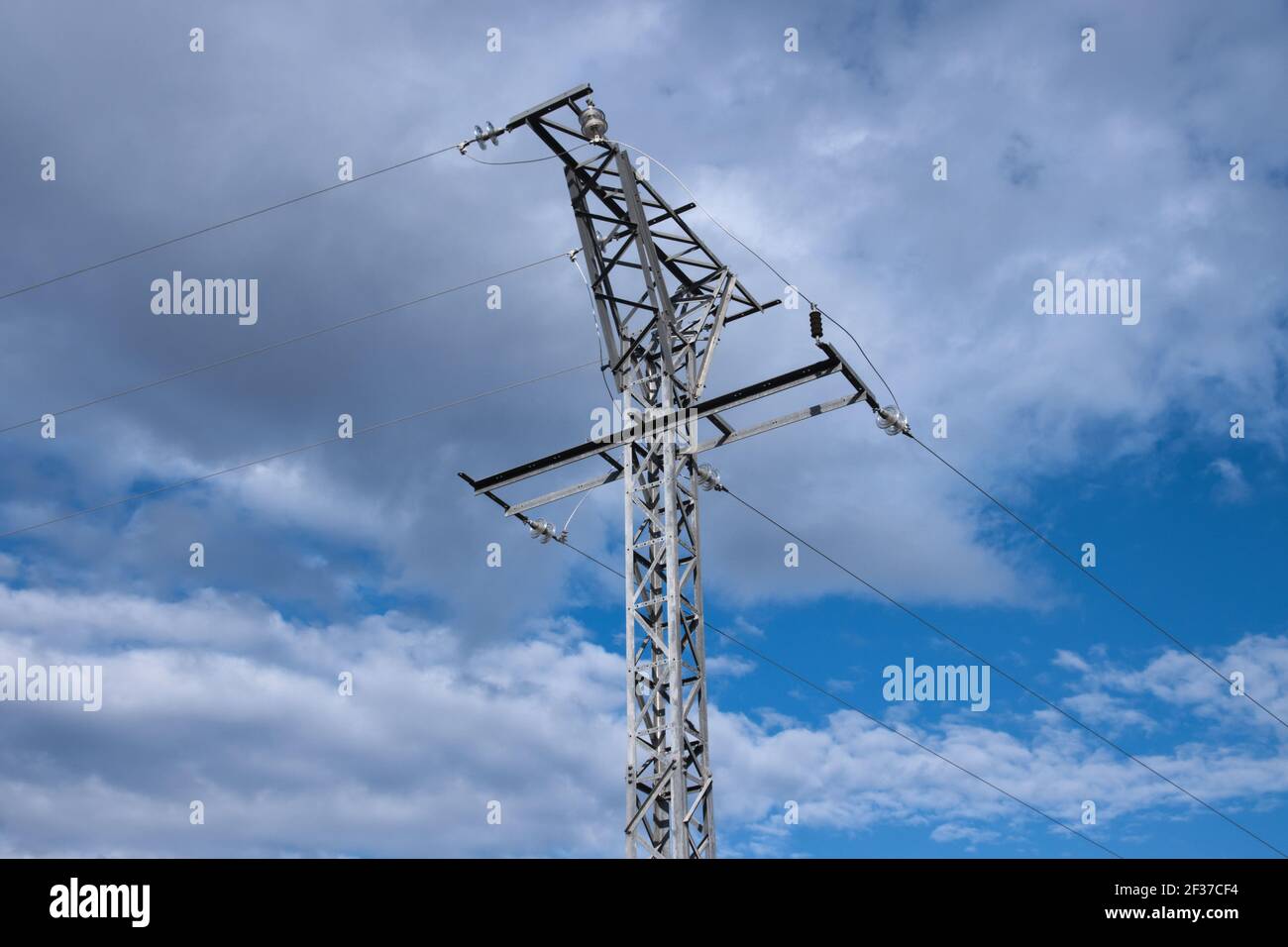 Image of an electric power transmission tower through cables with the ...