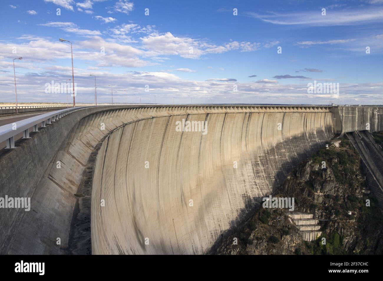 A closeup shot of a long concrete road on the top of the rock Stock ...