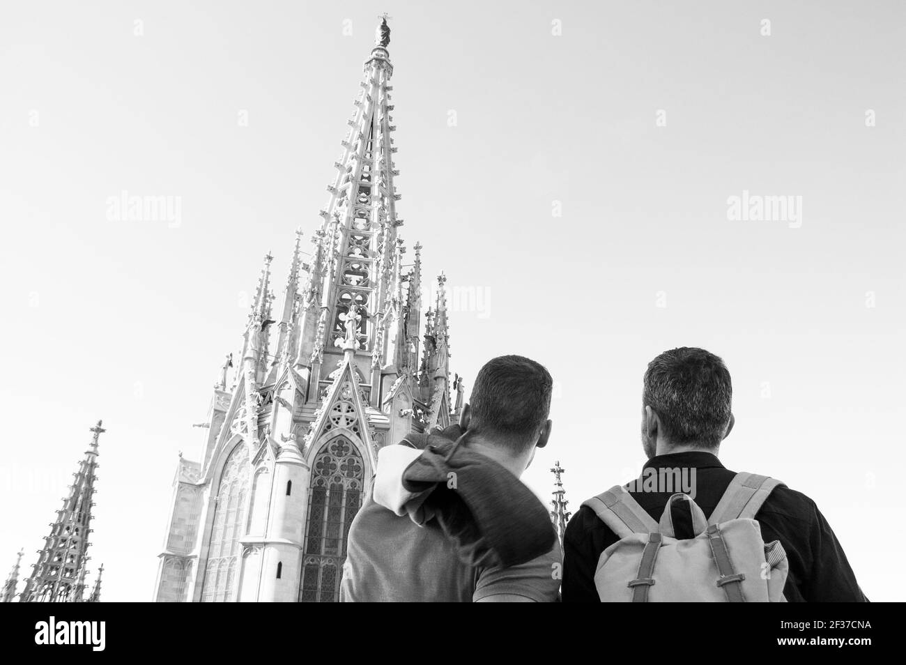 Two men (back view; unrecognizable), young and mid aged, admiring ...