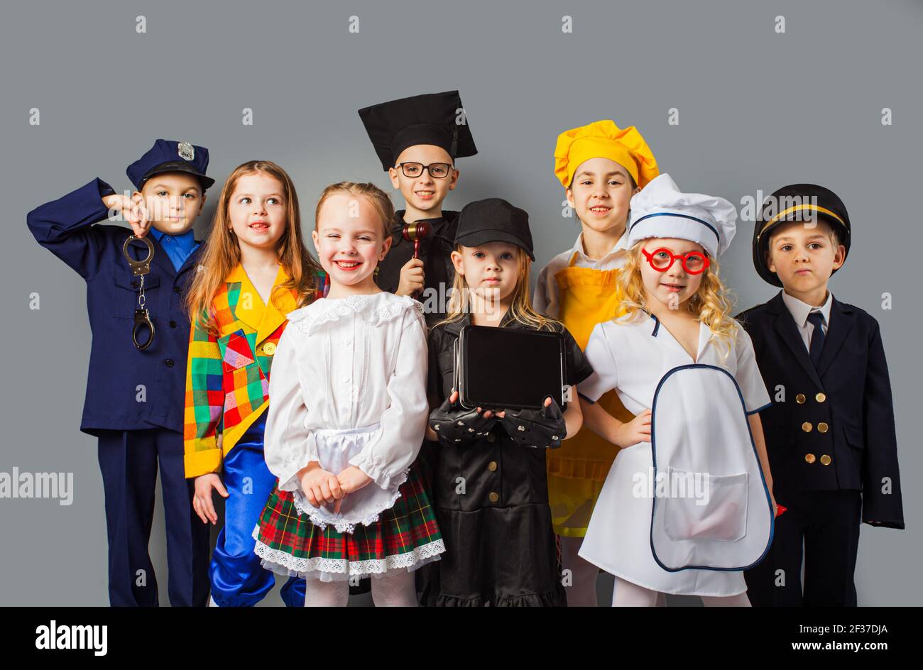Group of school children dressing up as professions Stock Photo - Alamy