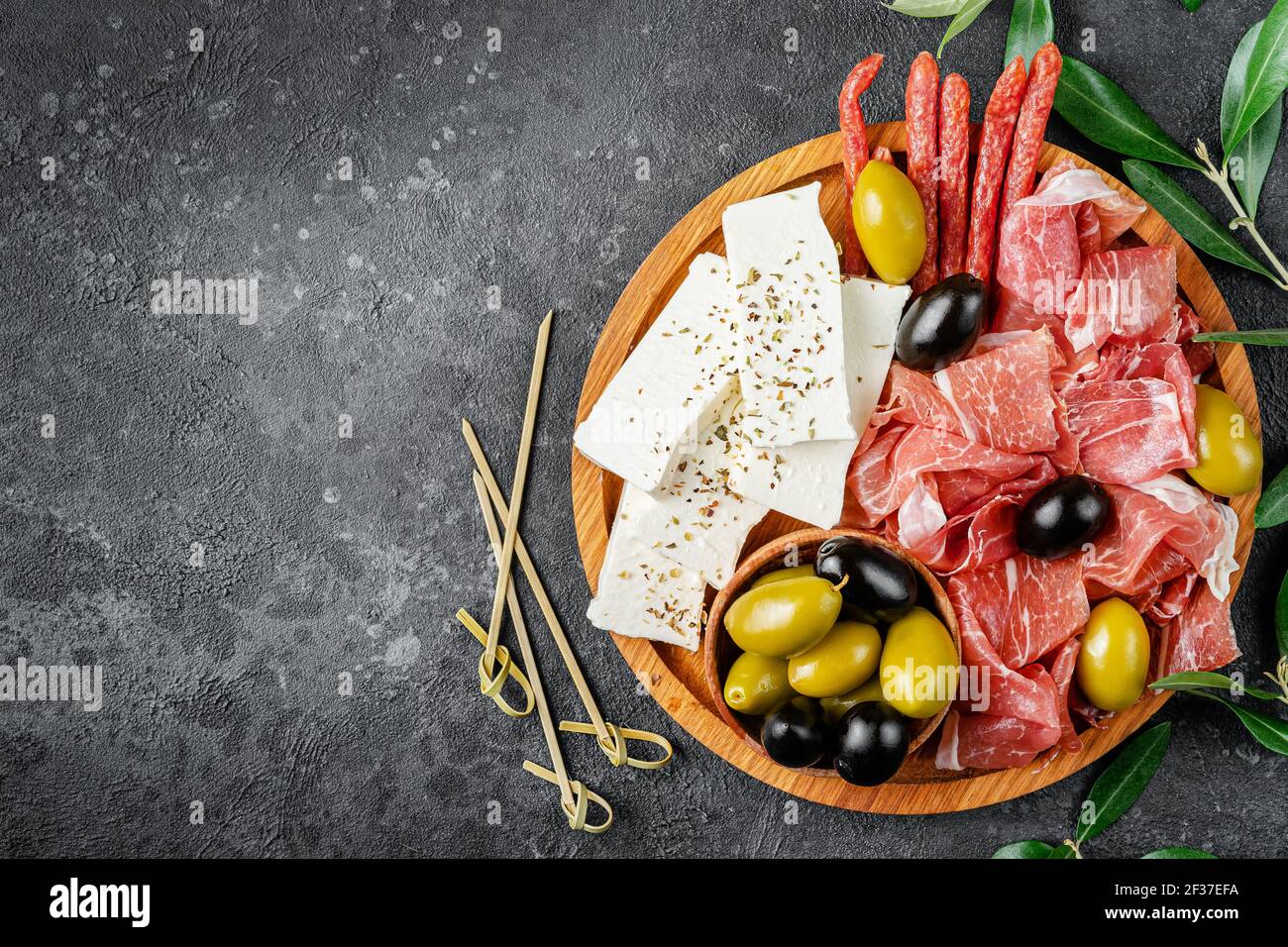 Italian appetizer platter on dark background. Top view, copy space ...
