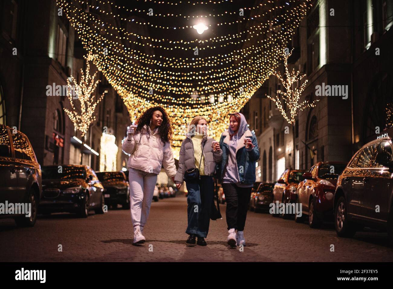 Friends Walking Together At Night