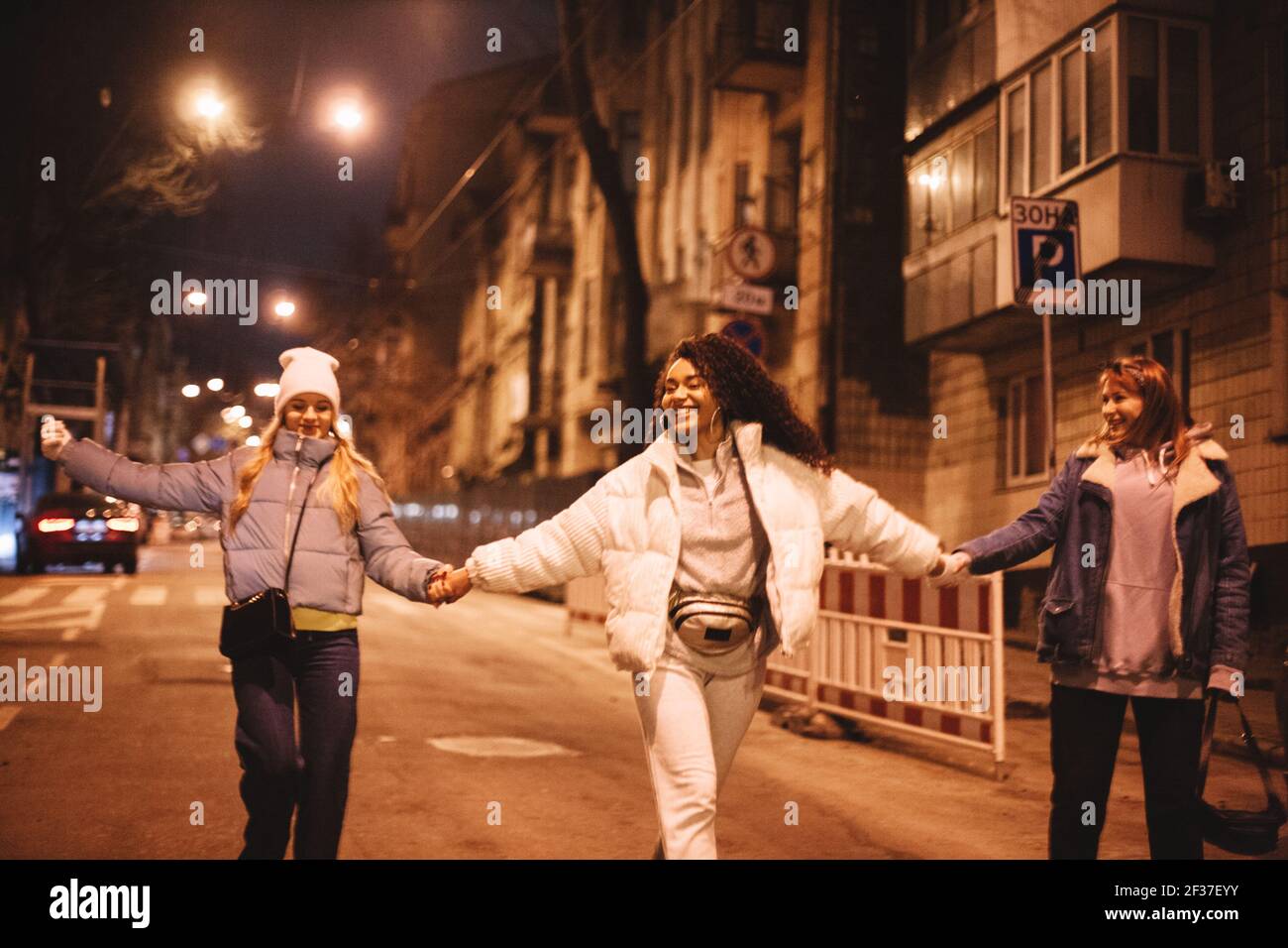 Friends Walking Together At Night