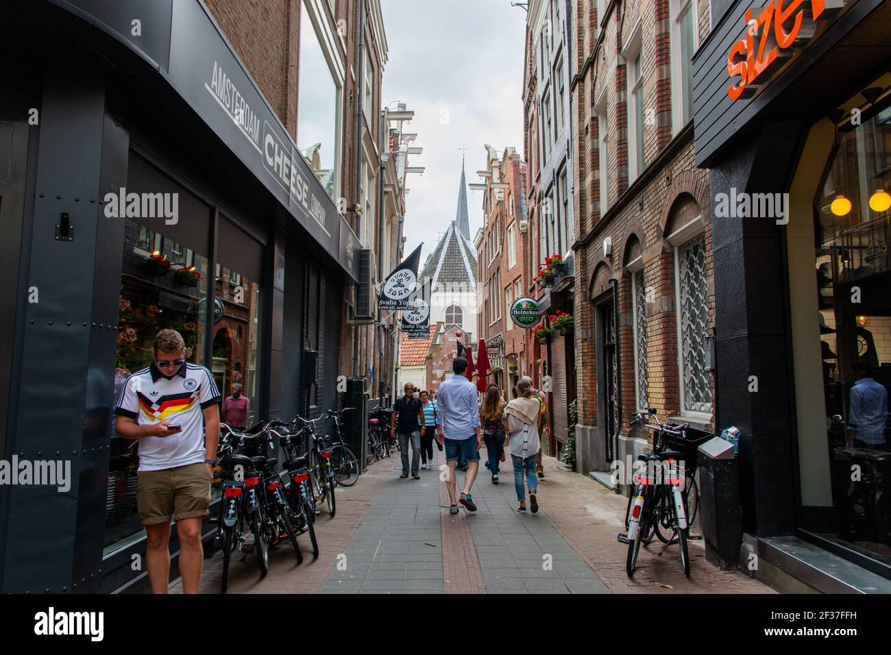Classic European buildings and pedestrians in a peaceful alley Stock ...