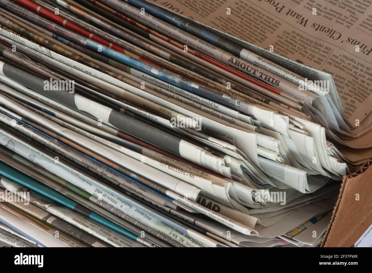 Newspapers in a stack to recycle, file or store. Closeup view of ...