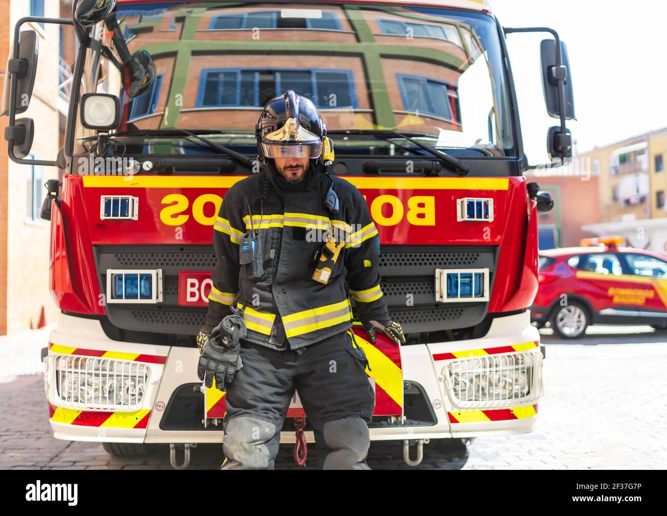 image of firefighter next to the water truck Stock Photo - Alamy