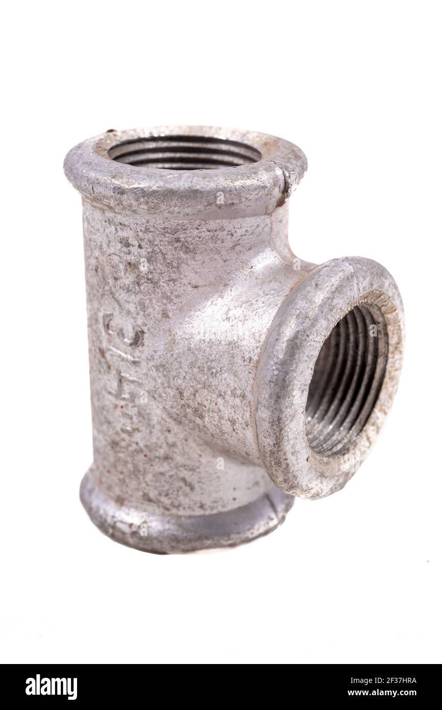 Metal hydraulic tee. A fitting used to connect water pipes. Light ...