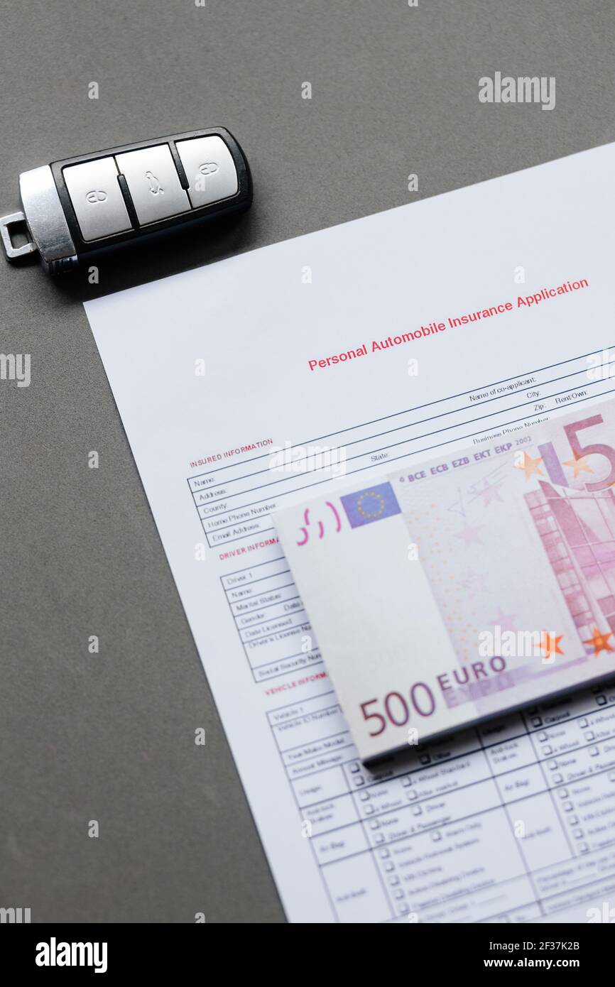 car insurance policy and keys with money Stock Photo - Alamy