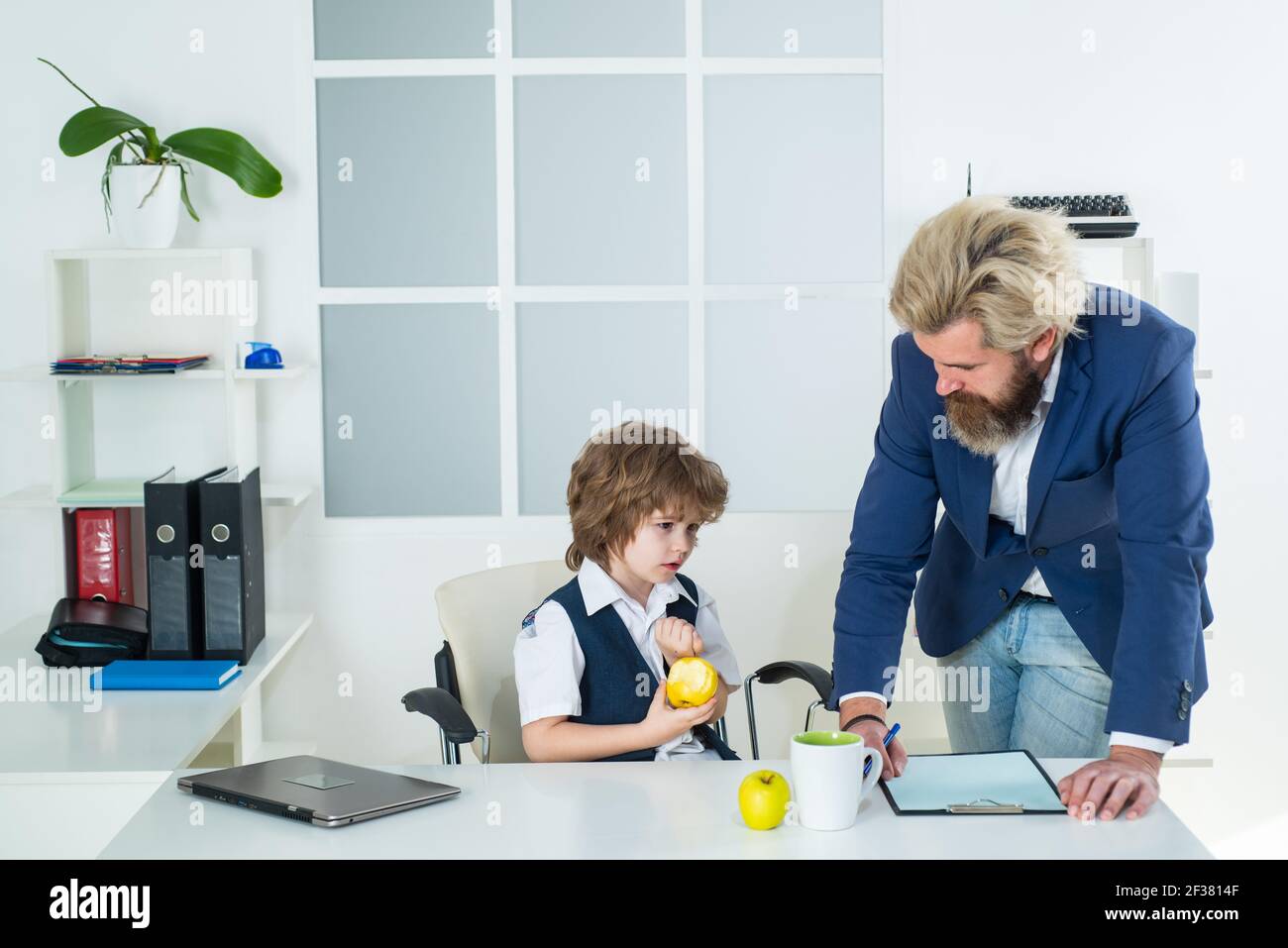 Little boss. Businessman bossy child working in office. Marketing team ...
