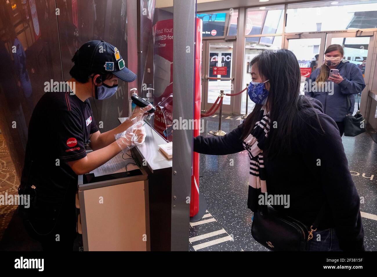 Moviegoers scan their tickets hi-res stock photography and images - Alamy
