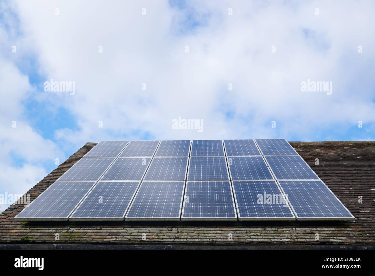 Solar photovoltaic panels on a clay tile roof in England, United ...