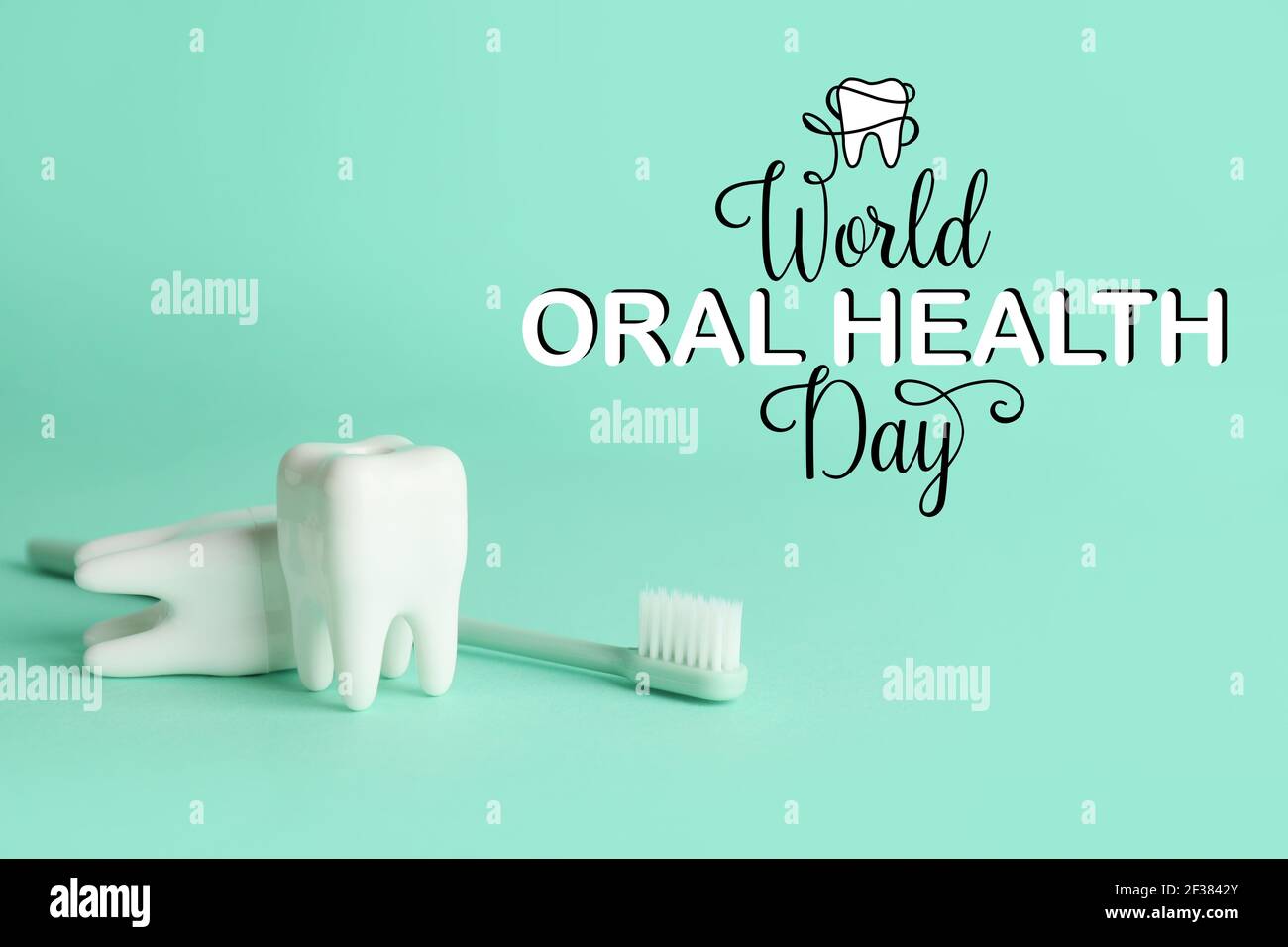 Teeth with toothbrush on color background. World Oral Health Day Stock ...
