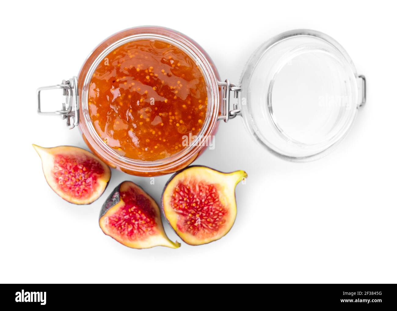 Glass jar with sweet fig jam on white background Stock Photo - Alamy