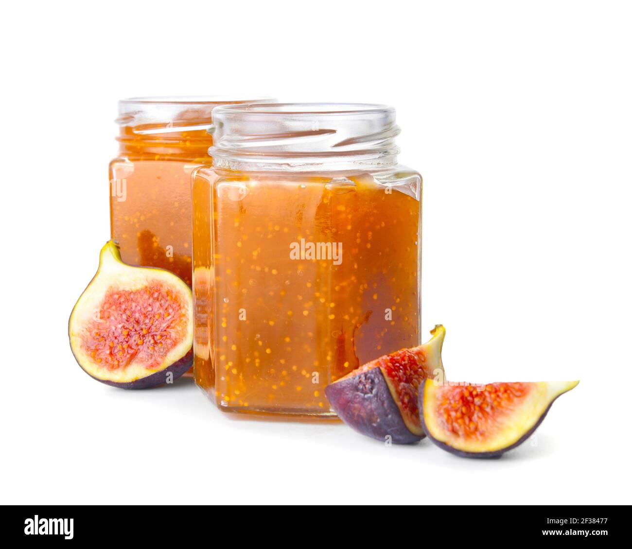 Glass jars with sweet fig jam on white background Stock Photo - Alamy