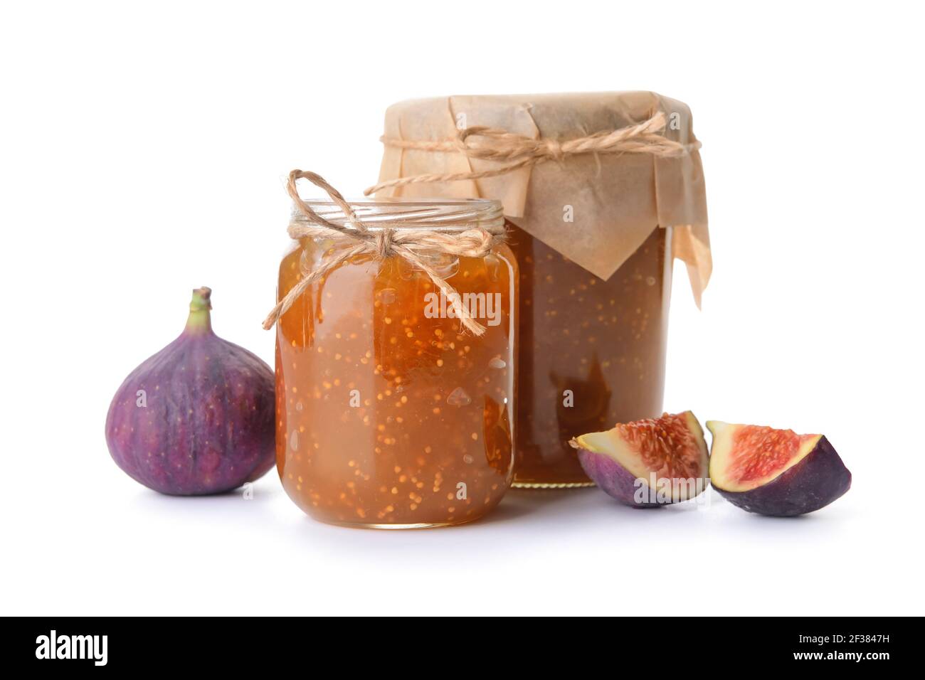 Glass jars with sweet fig jam on white background Stock Photo - Alamy