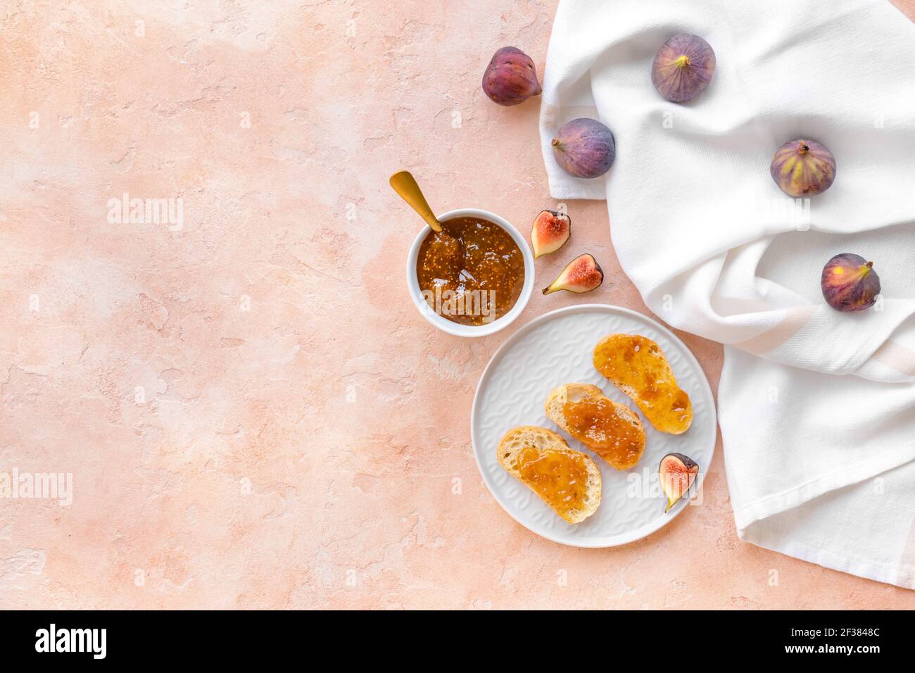 Composition with sweet fig jam on color background Stock Photo - Alamy