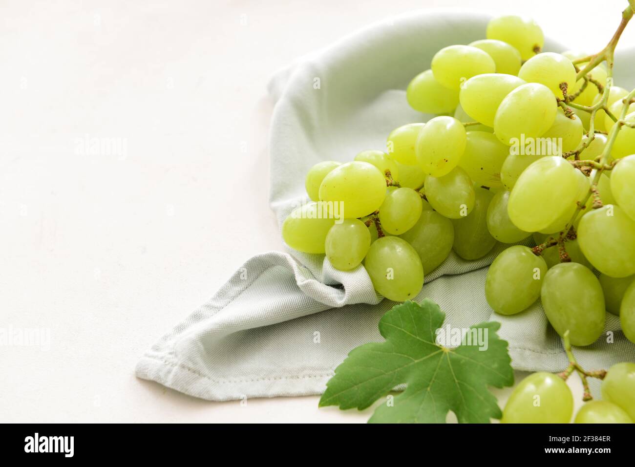 Ripe green grapes on white background Stock Photo - Alamy