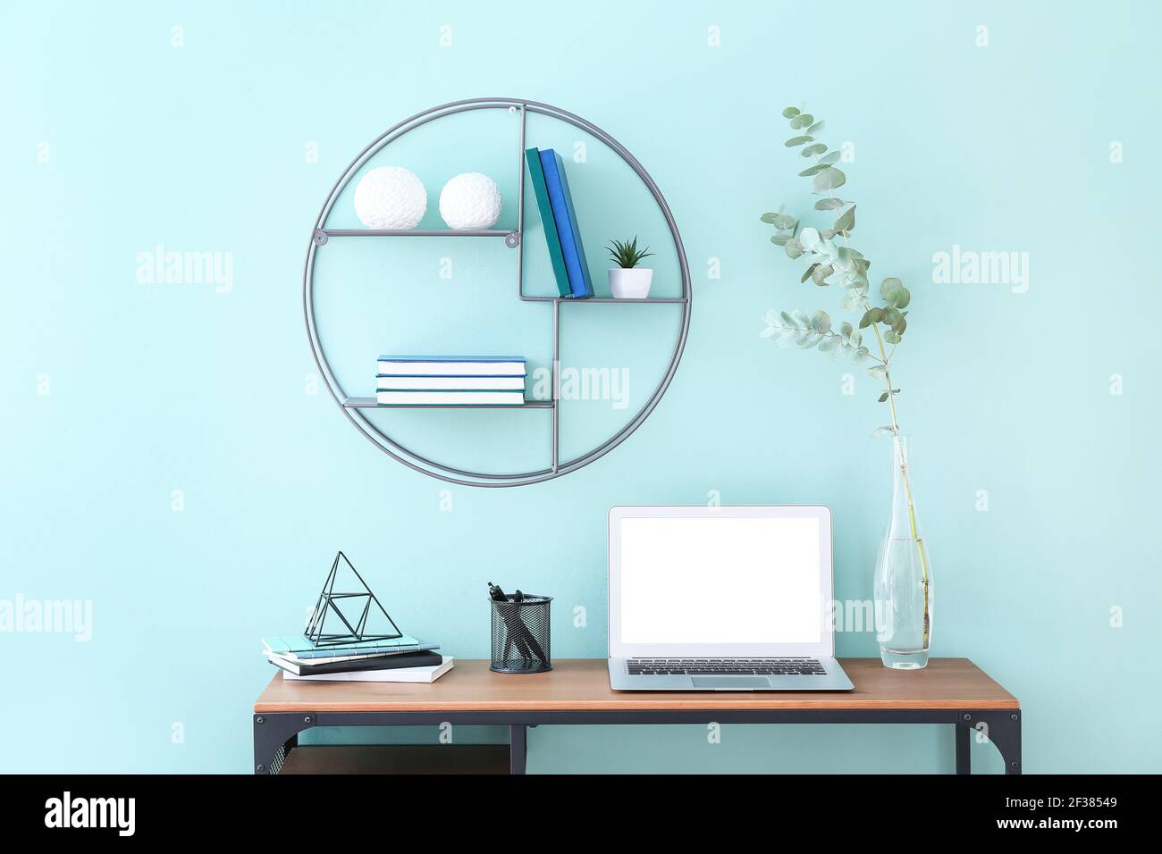 Stylish workplace with modern laptop against color wall in room Stock ...