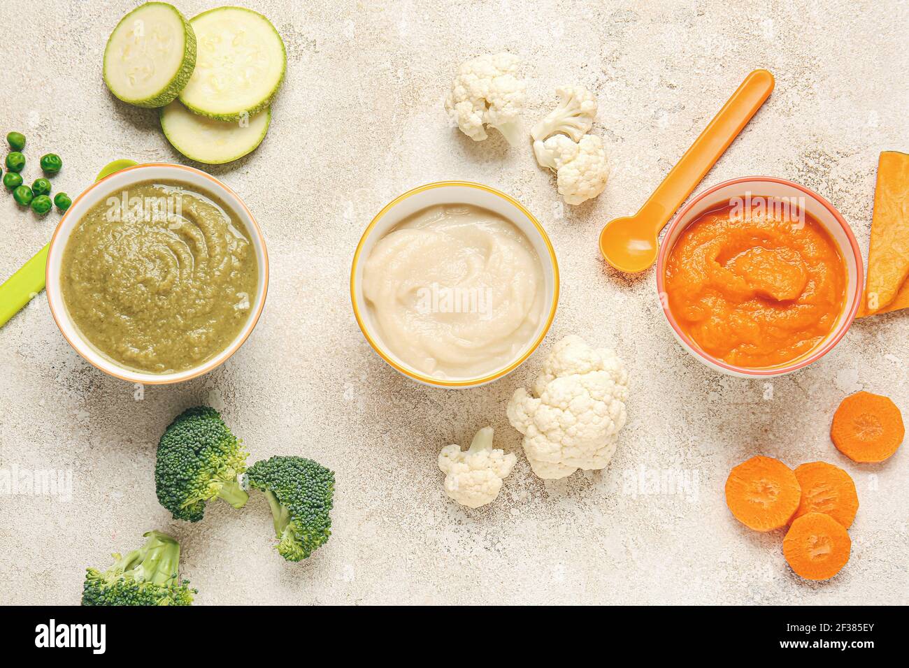 Composition with healthy baby food and ingredients on light background ...