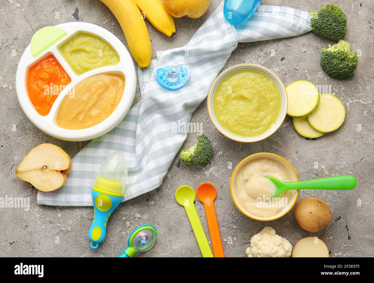Composition with healthy baby food on dark background Stock Photo - Alamy