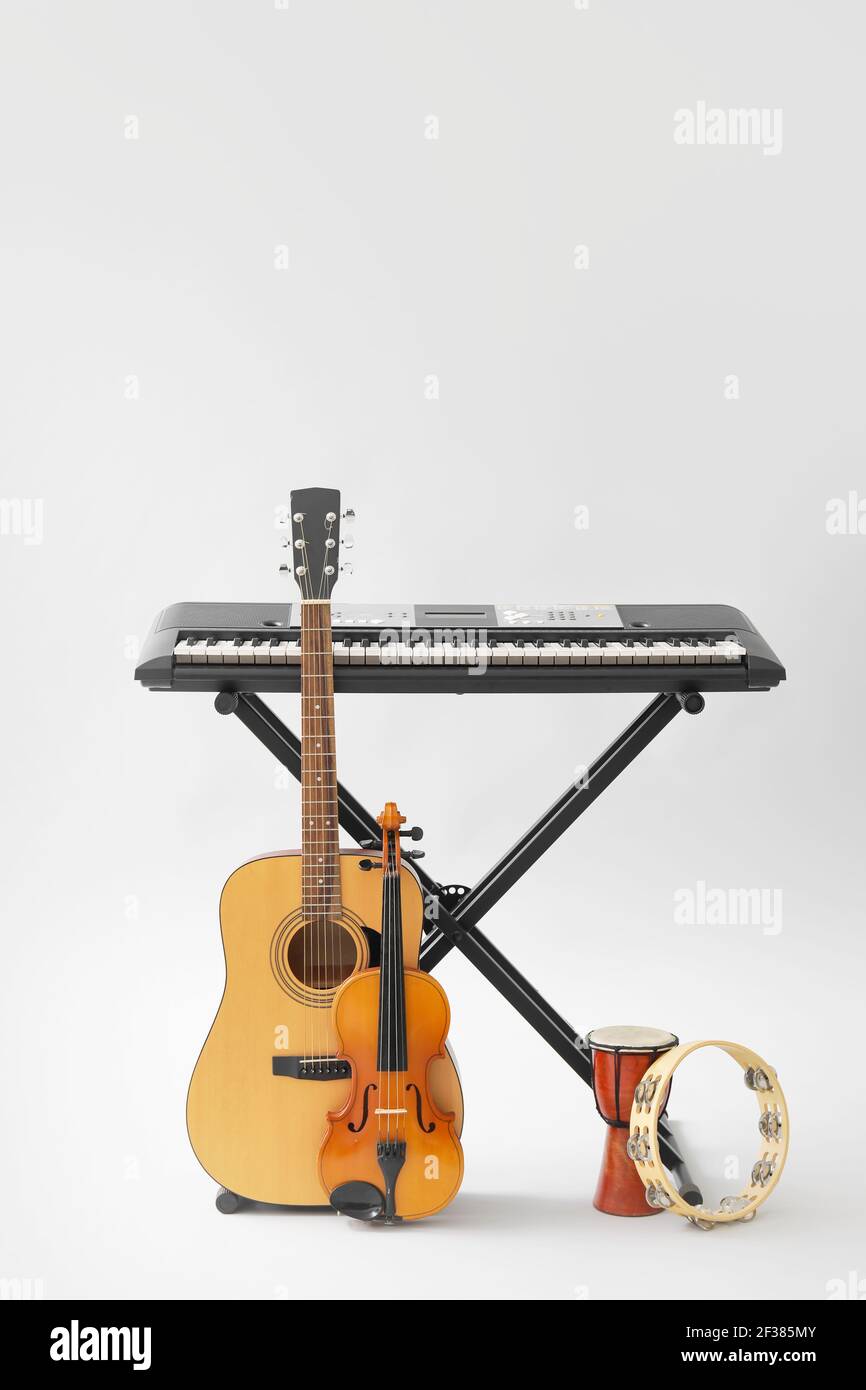Different musical instruments on white background Stock Photo - Alamy