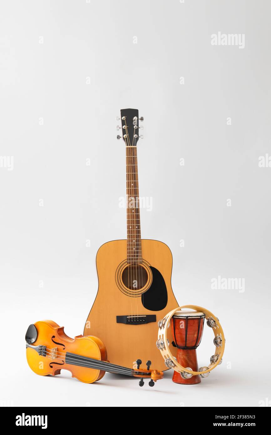Different musical instruments on white background Stock Photo - Alamy