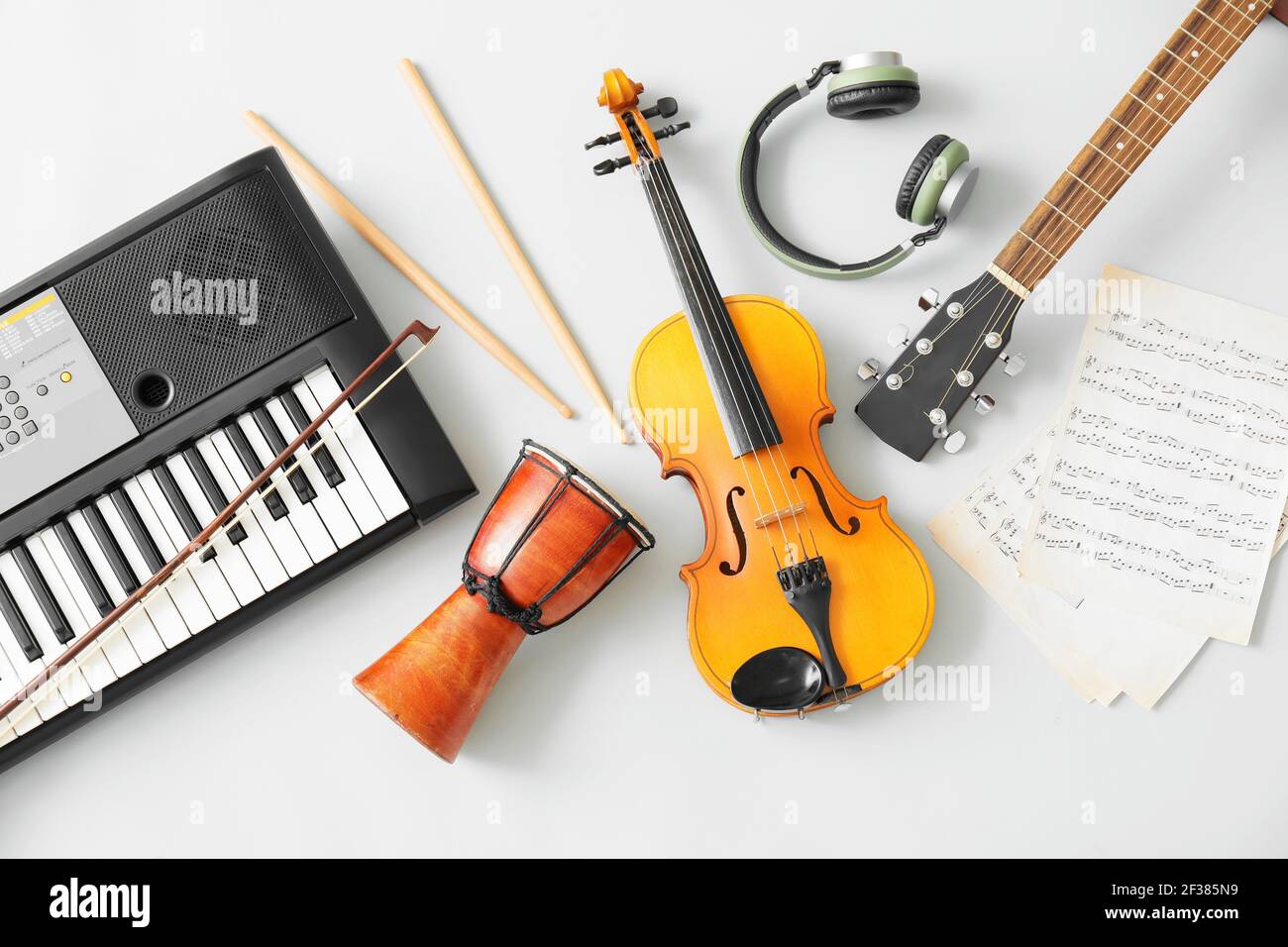 Different musical instruments and music notes on light background Stock ...