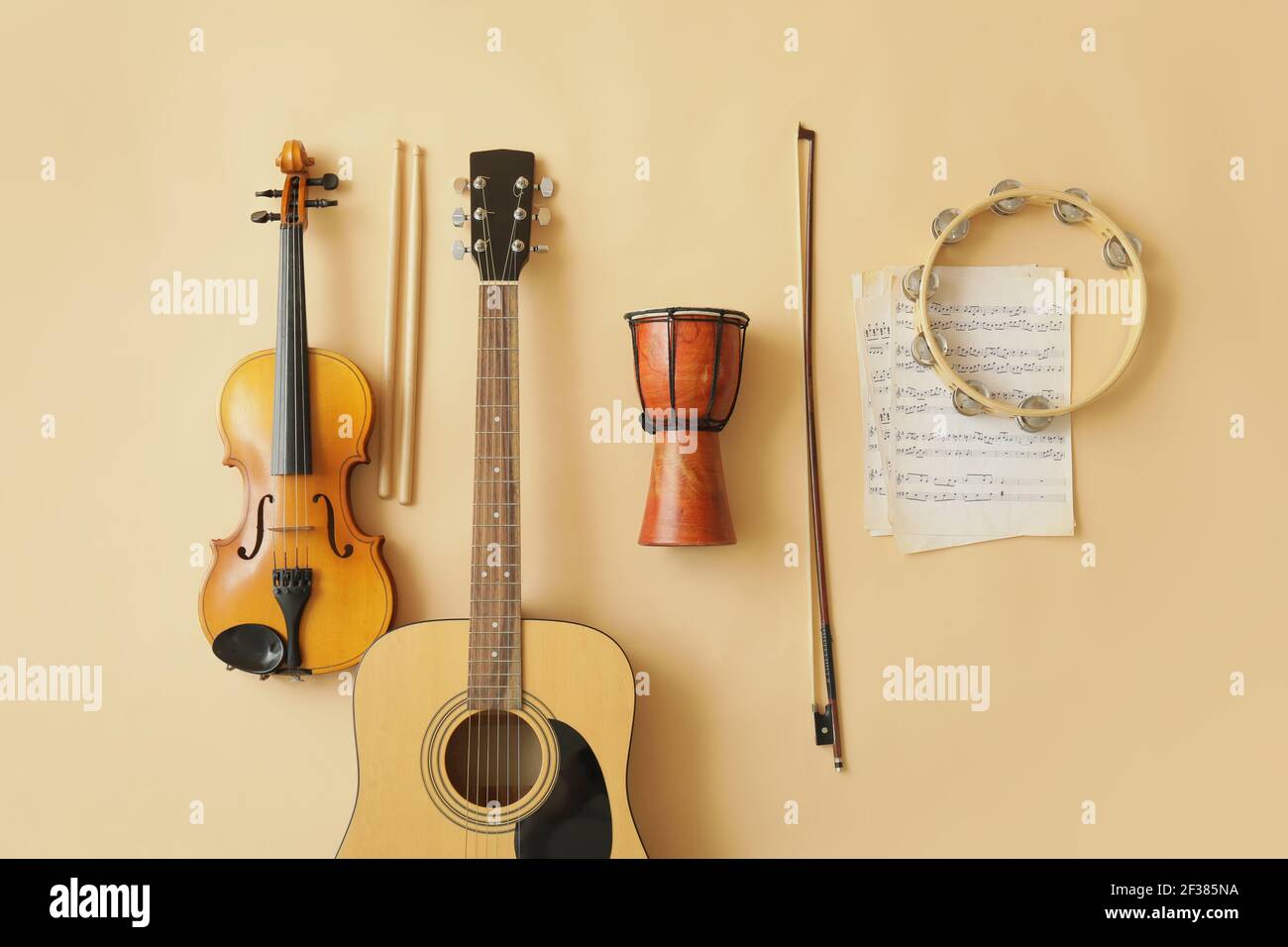 Different musical instruments and music notes on color background Stock ...